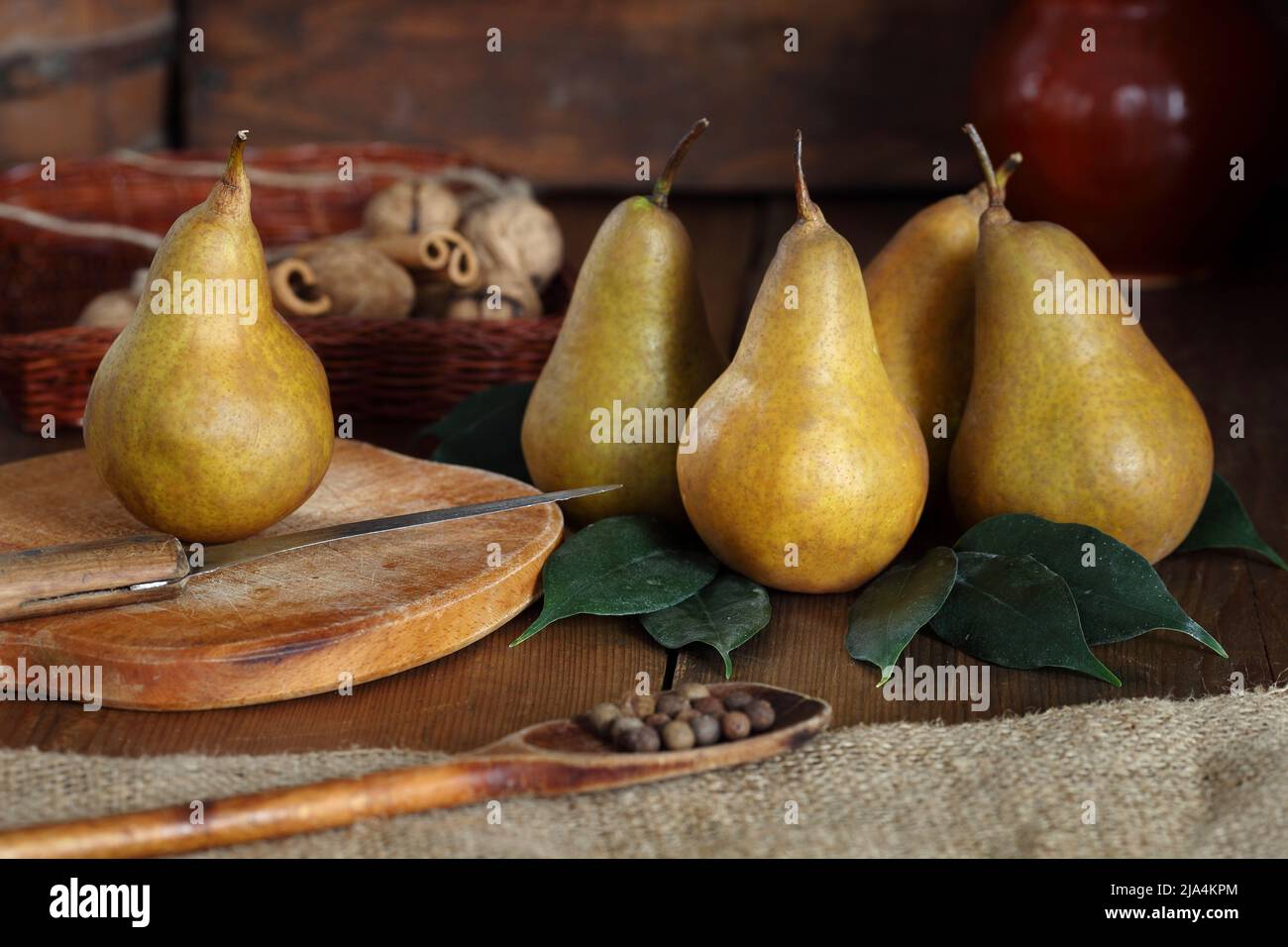 group of ripe pears lie on old wooden boards Stock Photo - Alamy