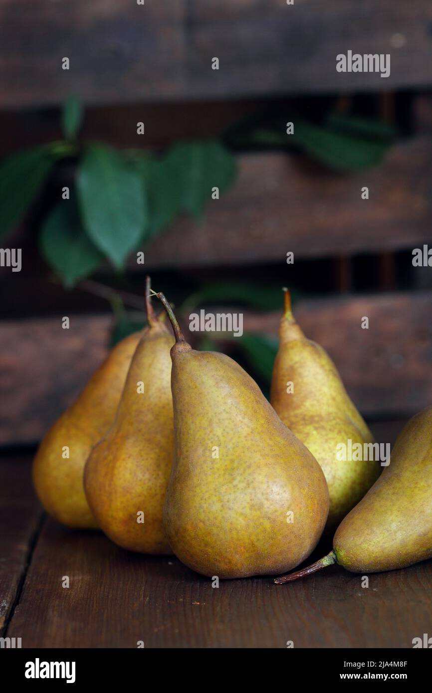 group of ripe pears lie on old planed wooden boards Stock Photo - Alamy