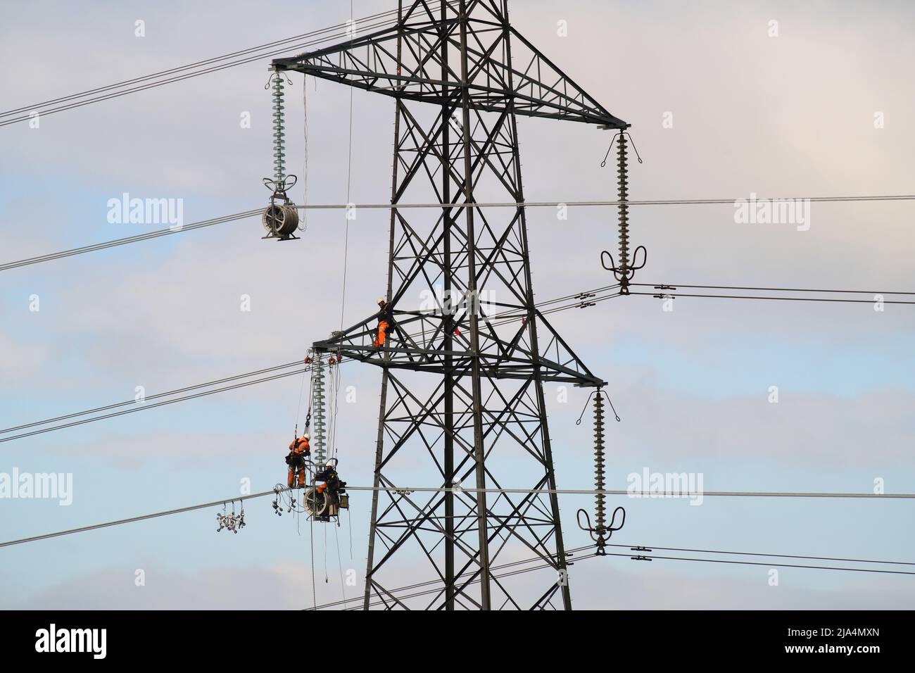 engineers replacing high tension electricity power cables york ...