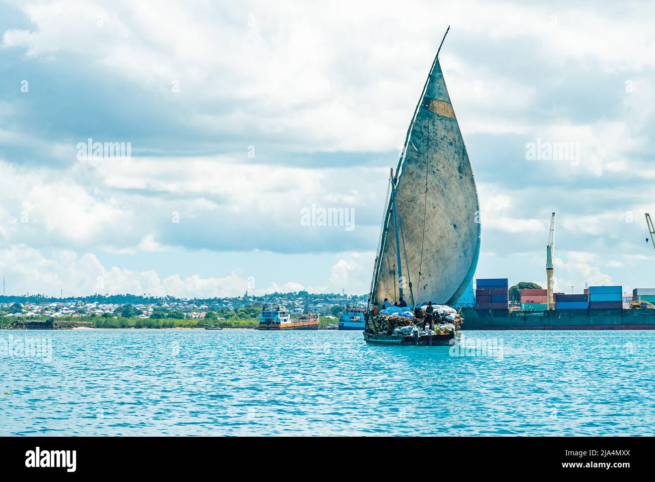 Wooden ship with timber in water of Indian ocean heading port of Stone ...