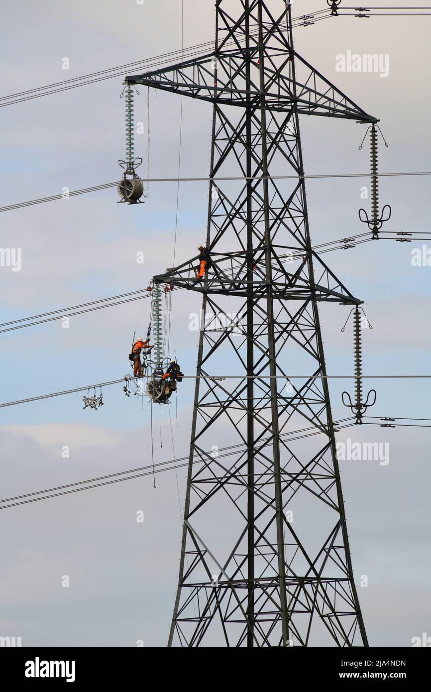 engineers replacing high tension electricity power cables york ...
