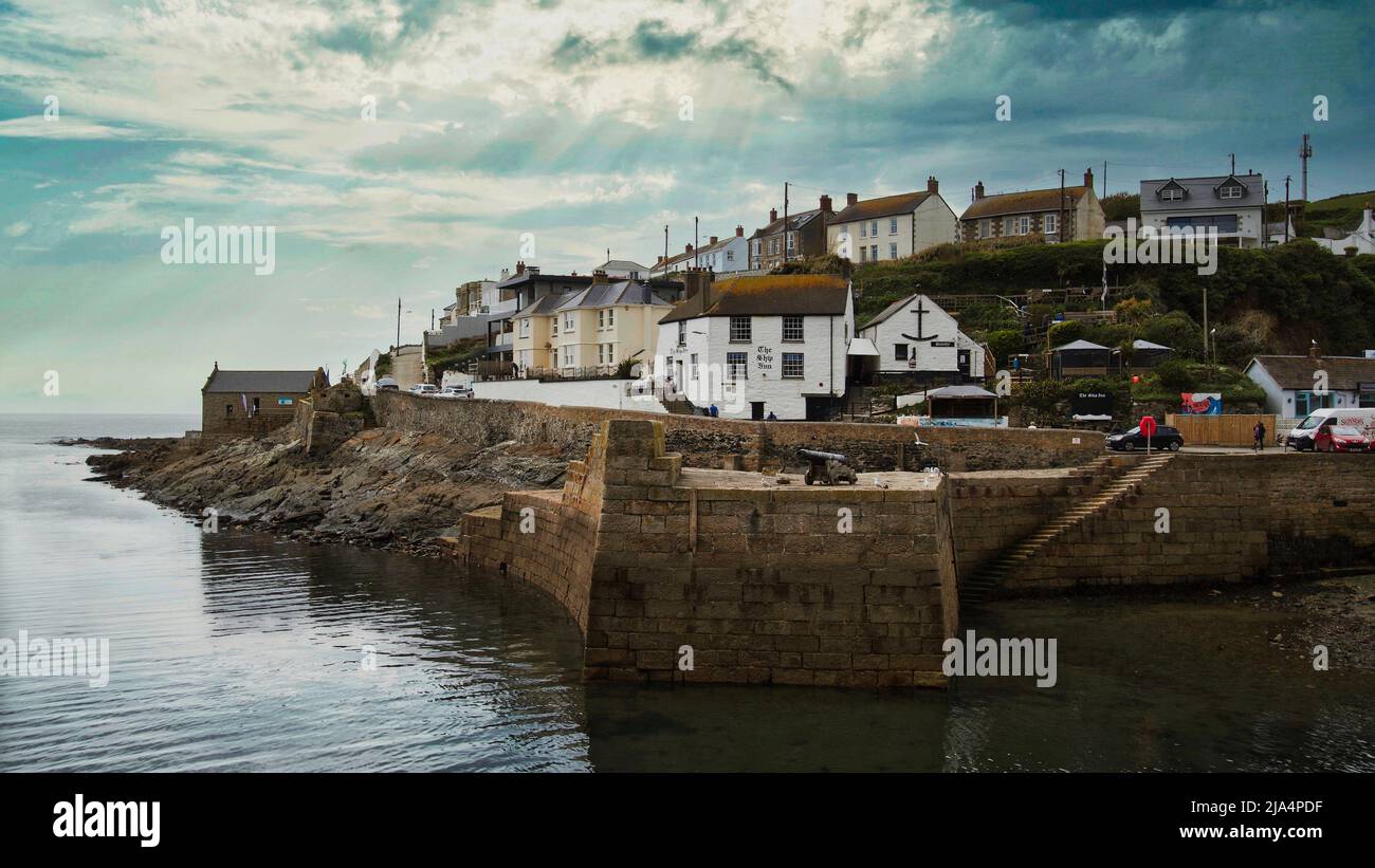Porthleven harbour in Cornwall on a calm spring day with views of the ...