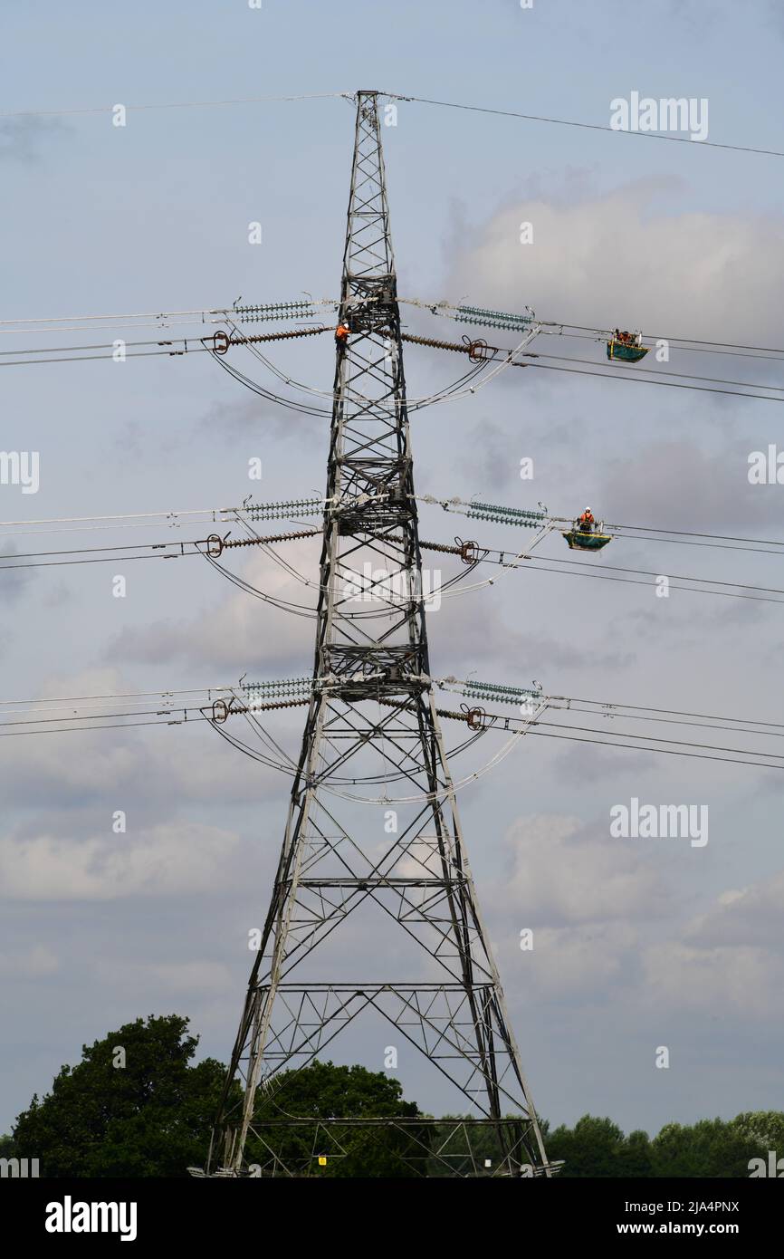 engineers replacing high tension electricity power cables york ...