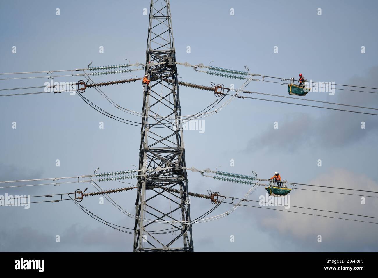 engineers replacing high tension electricity power cables york ...