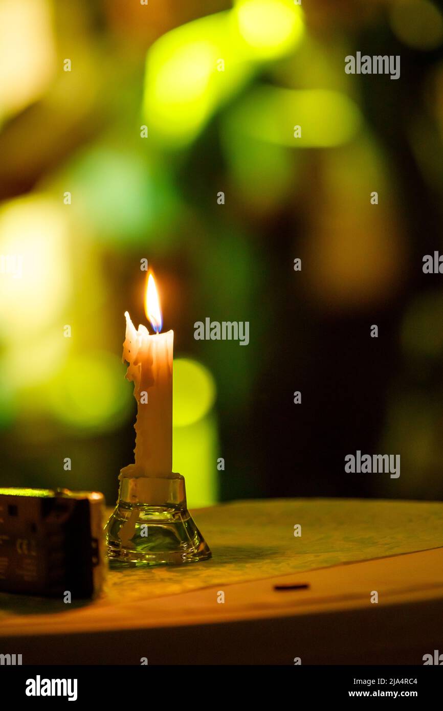 A burning candle and flame Stock Photo - Alamy