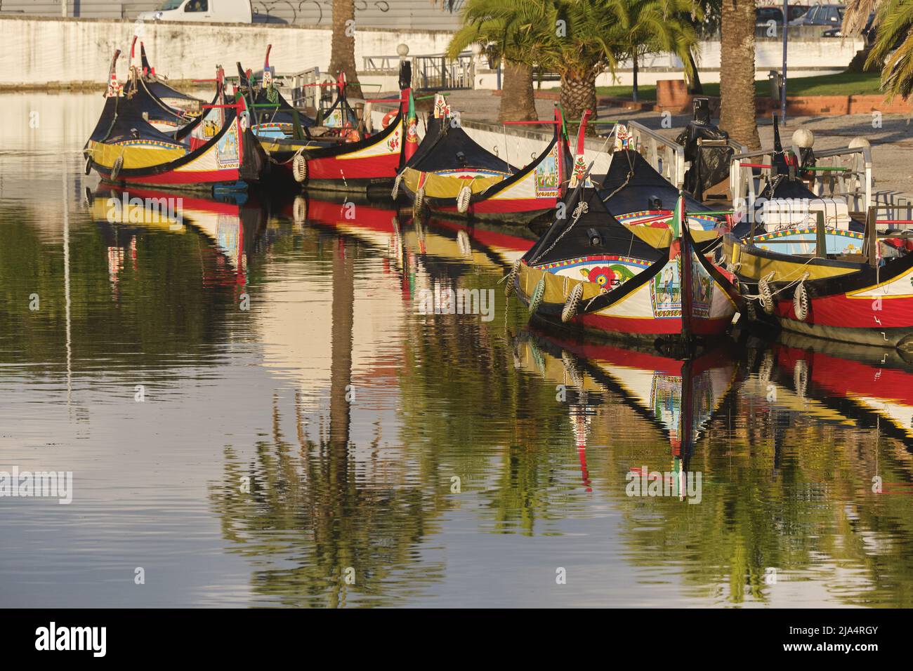 popular with tourists colorful Moliceiros boat moored along a canal in ...