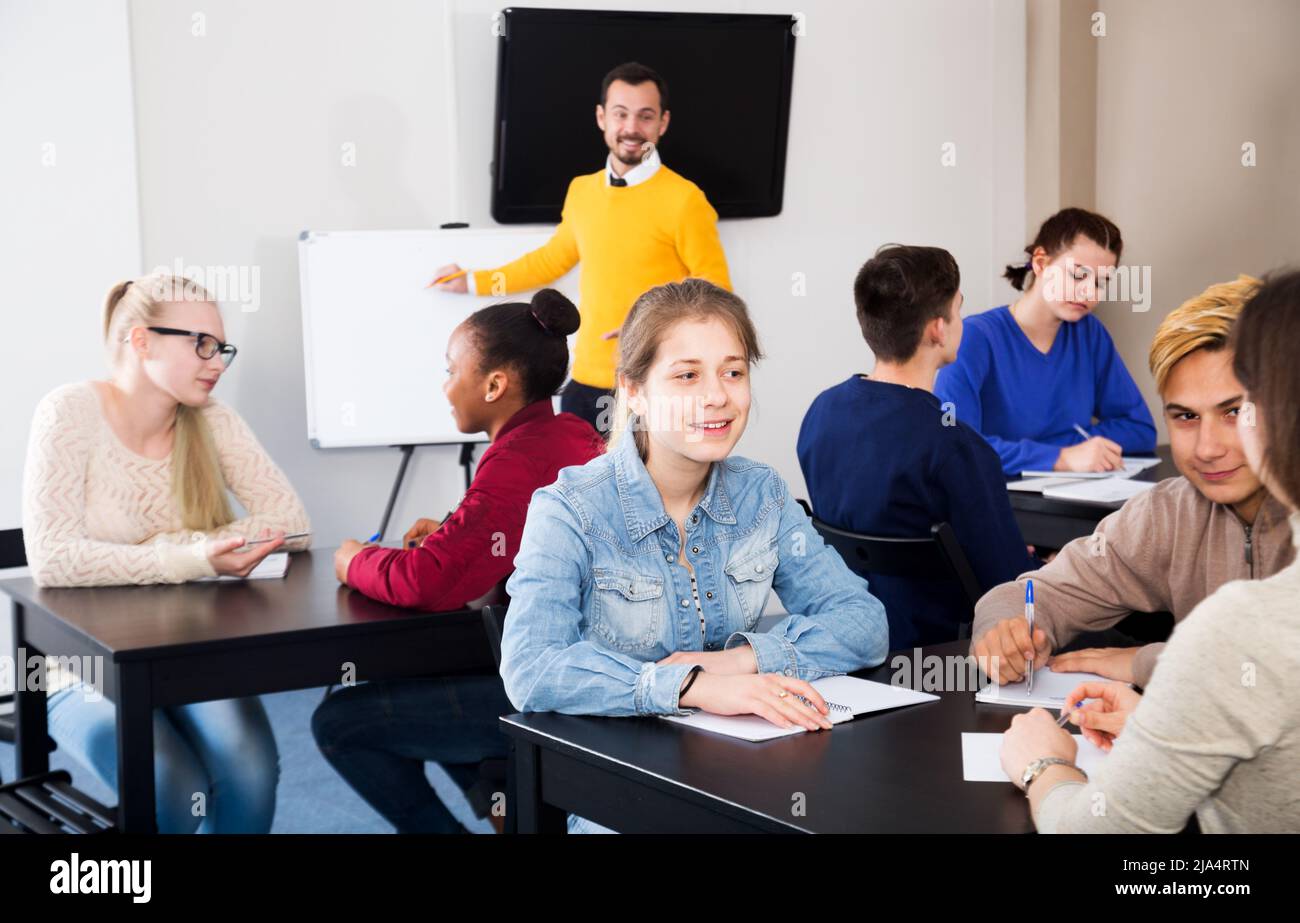 Classmates working in groups Stock Photo - Alamy