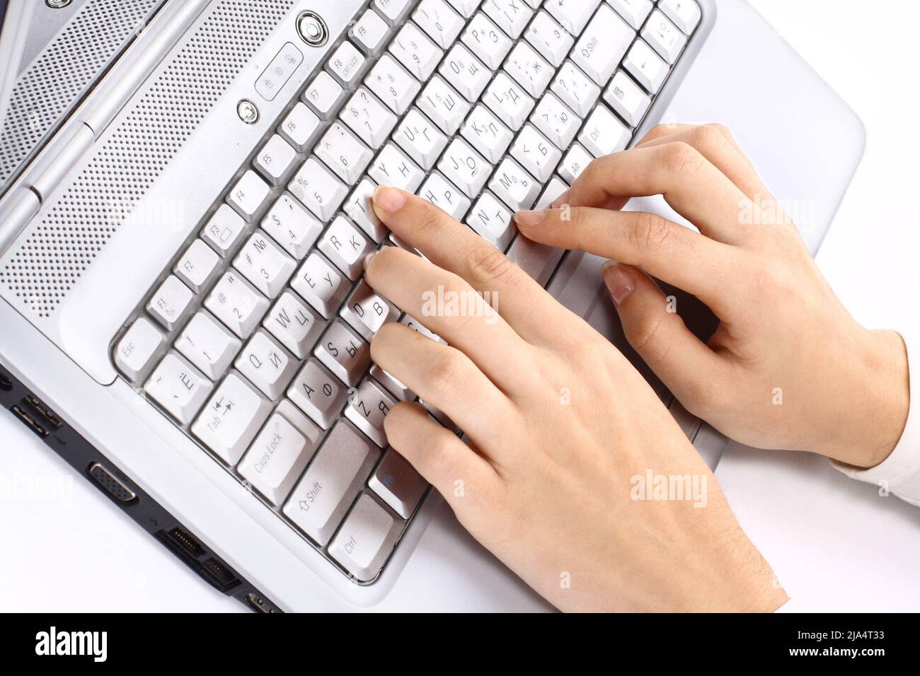 Hands on the laptop keyboard. Isolated on white background Stock Photo ...