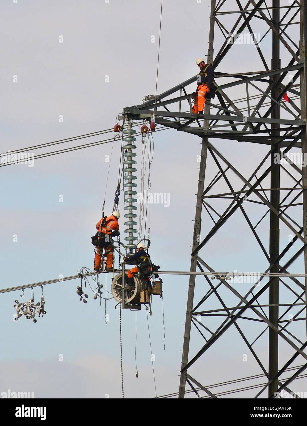 engineers replacing high tension electricity power cables york ...
