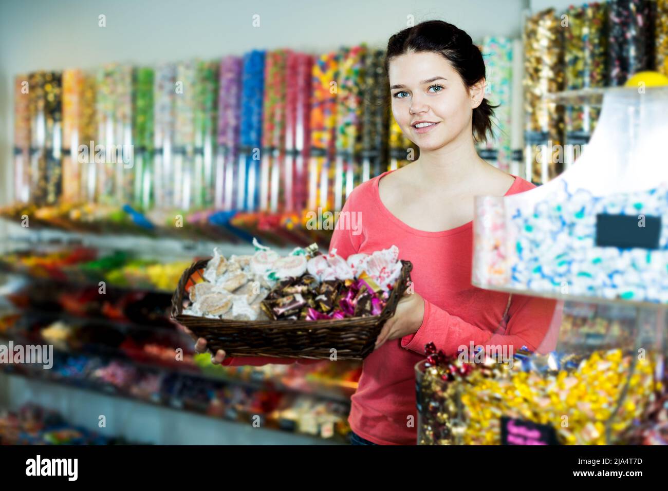Girl in the shop with lots of sweets Stock Photo - Alamy