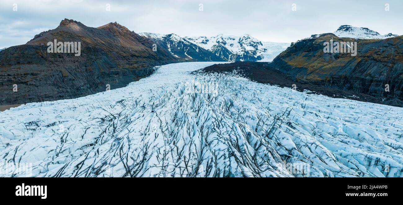Beautiful glaciers flow through the mountains in Iceland Stock Photo ...
