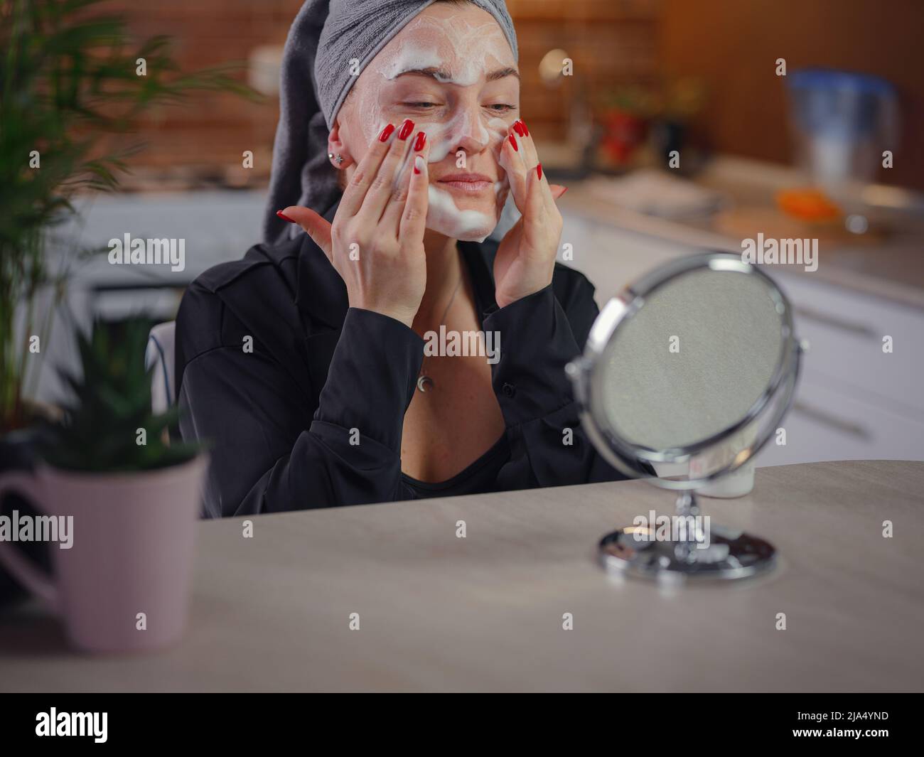 Enjoying flawless skin . Peaceful lady being satisfied with condition ...