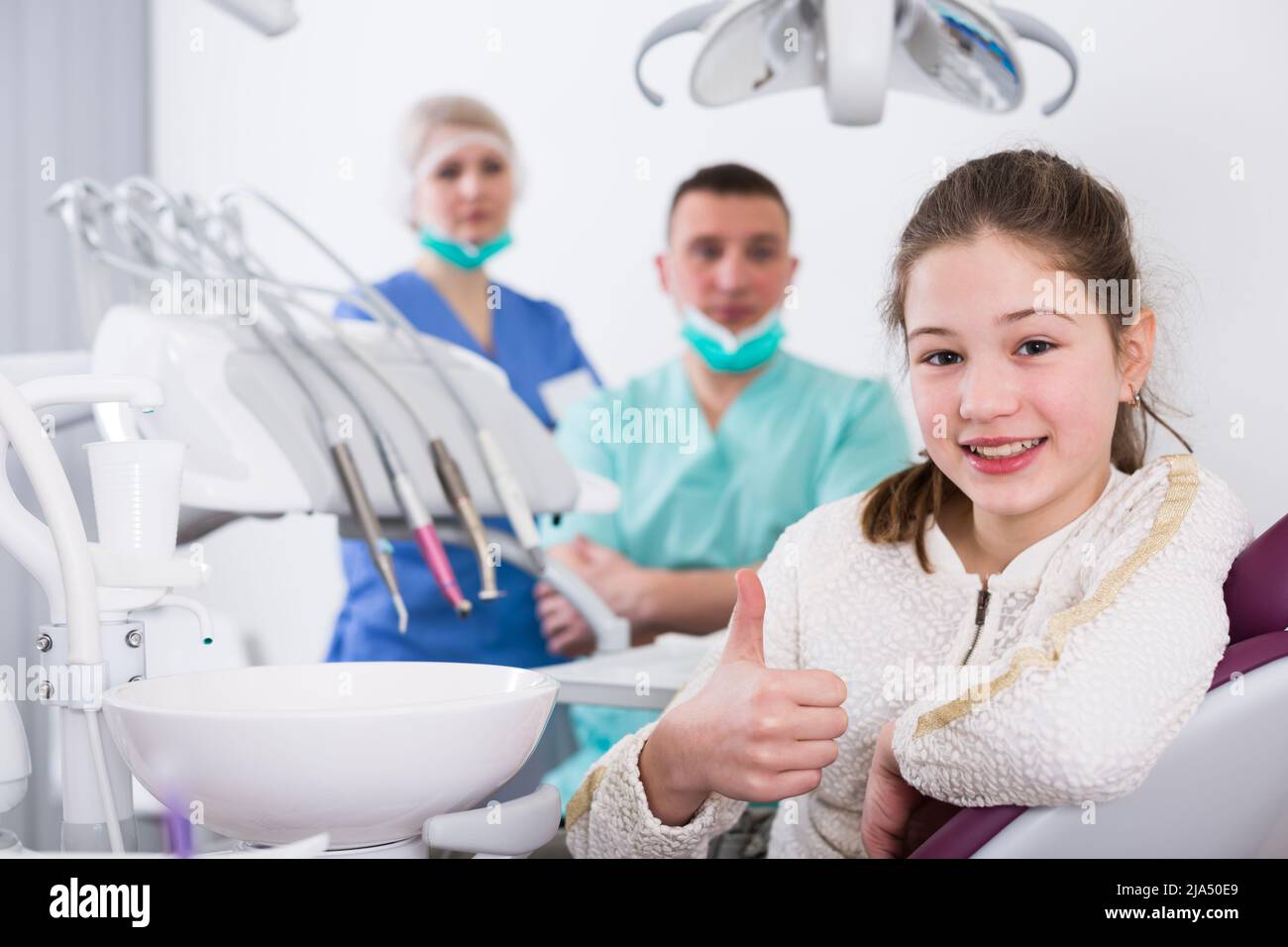 Teen girl showing thumbs hi-res stock photography and images - Alamy