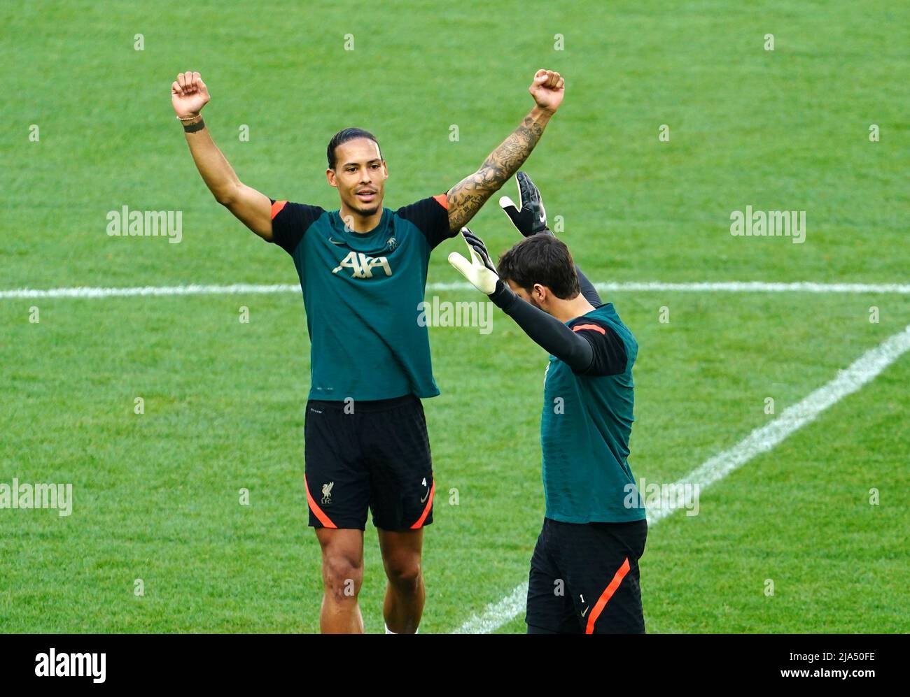 Liverpool's Virgil van Dijk and goalkeeper Alisson during a training ...