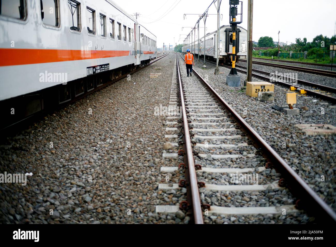 Railway officer checking the railway track Stock Photo - Alamy