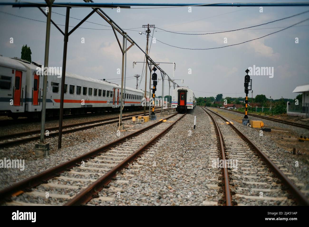 Passanger train stopped at station in Java Island, Indonesia Stock ...
