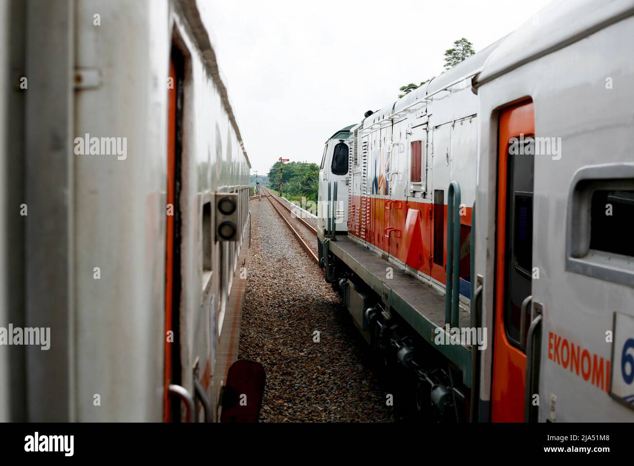 Locomotive and passanger train stopped at station in Java Island ...