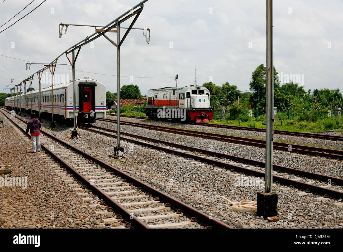 Locomotive and passanger train at station in Java Island Indonesia ...
