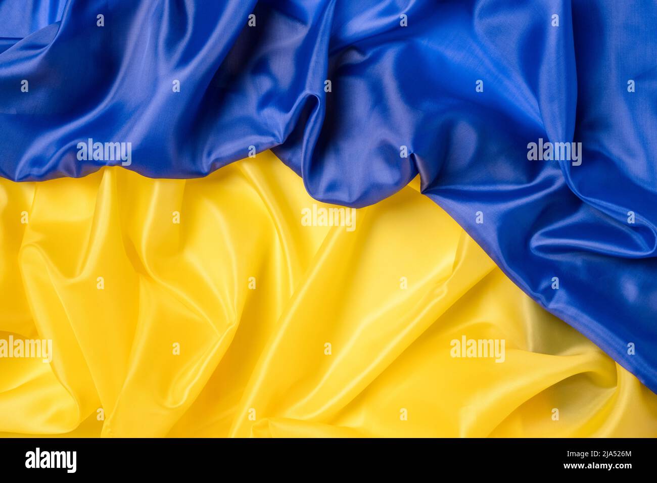 Fabric flag of Ukraine. Curved Ukrainian flag with ripples and material ...