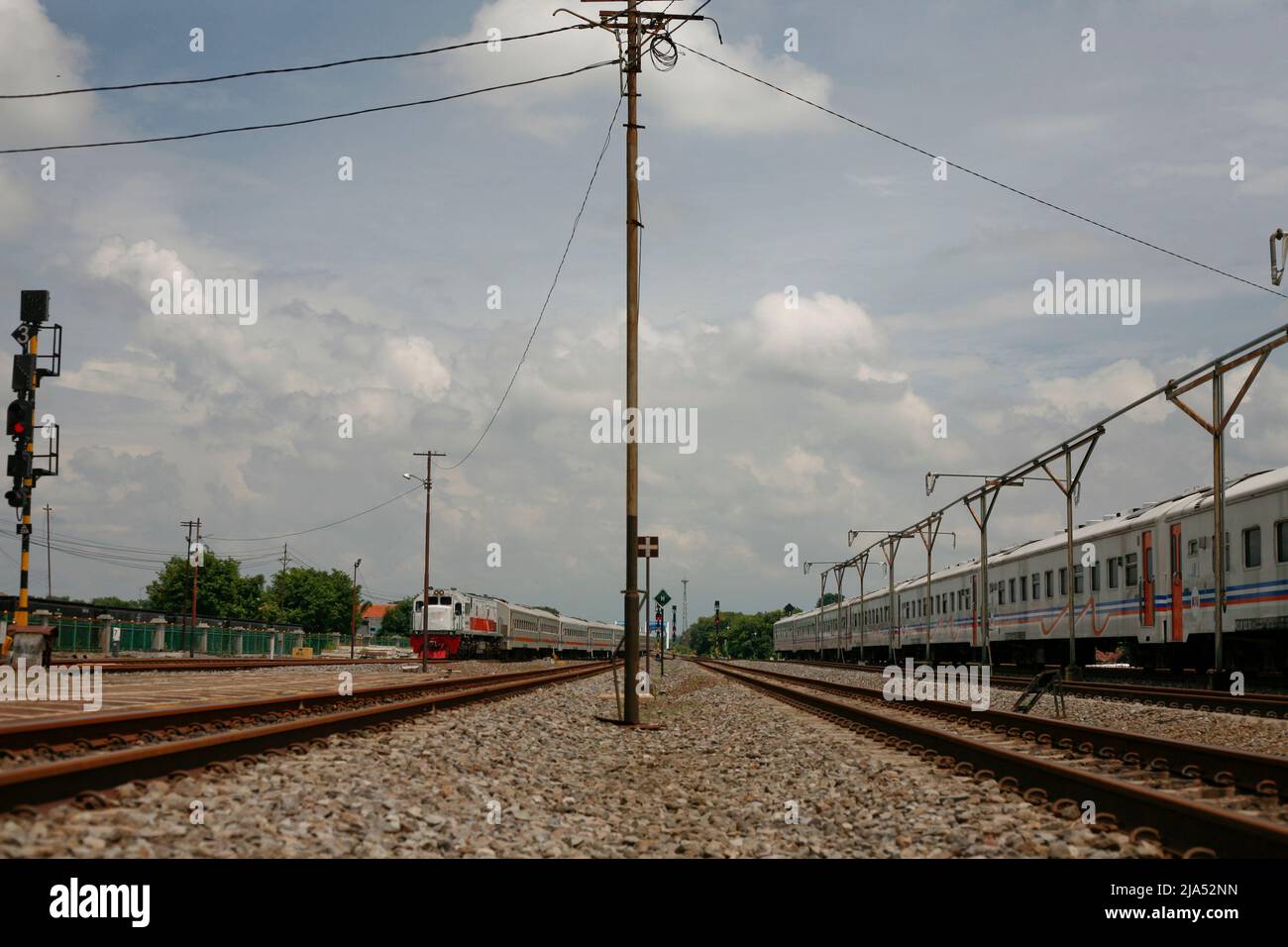 Locomotive and passanger train stopped at station in Java Island ...