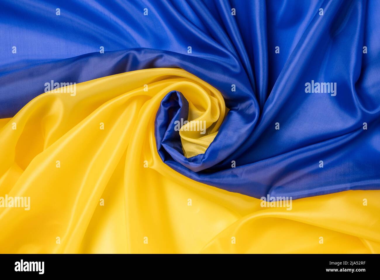 Fabric flag of Ukraine. Curved Ukrainian flag with ripples and material ...