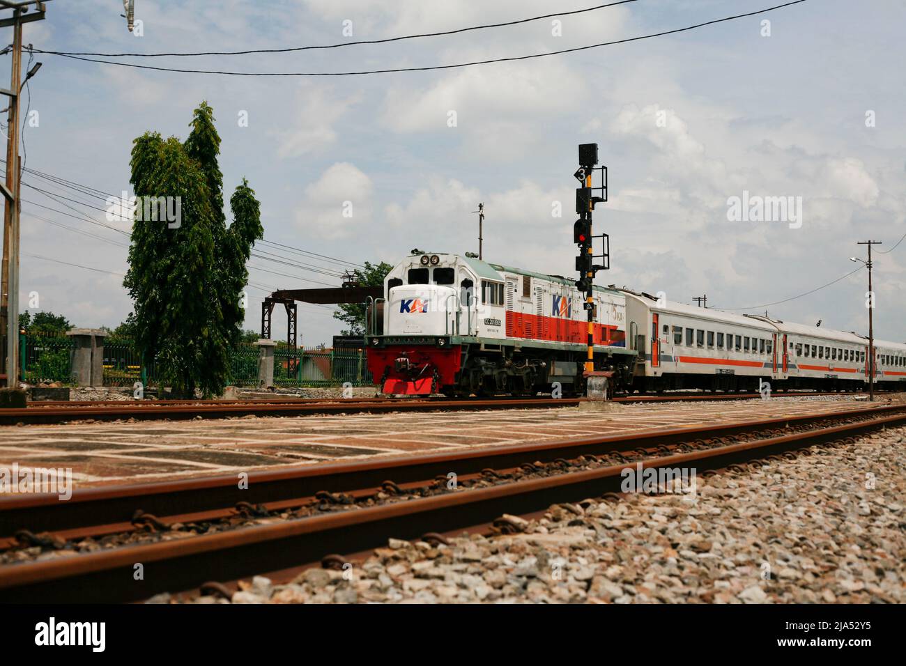 Locomotive and passanger train at Kertosono station in Java Island ...