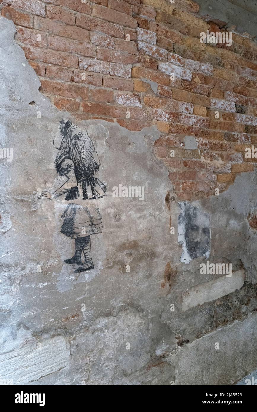 Alice in Wonderland graffiti in a Venice alley. Venice Italy Stock ...