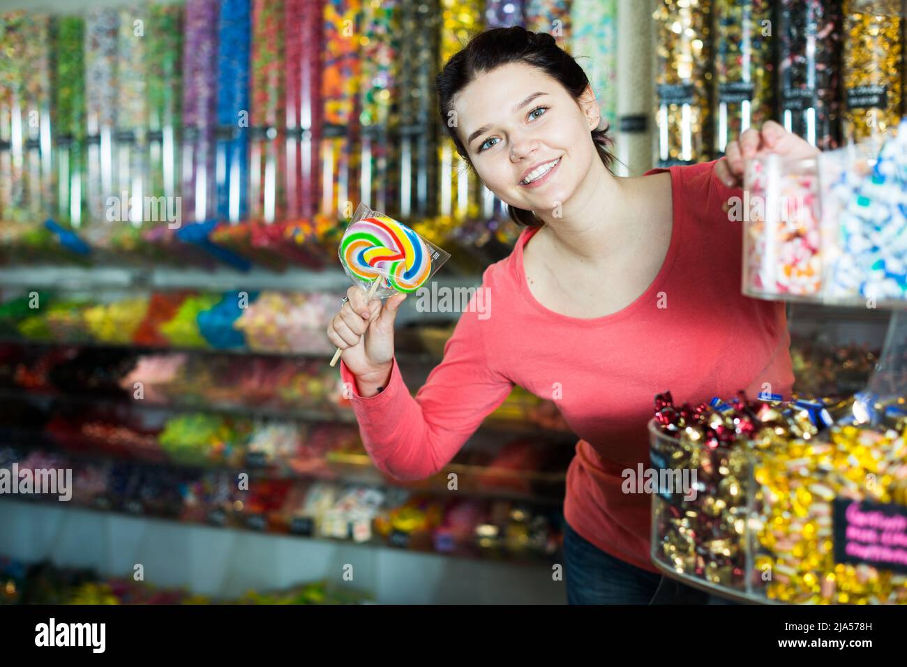 girl buying candies at shop Stock Photo - Alamy