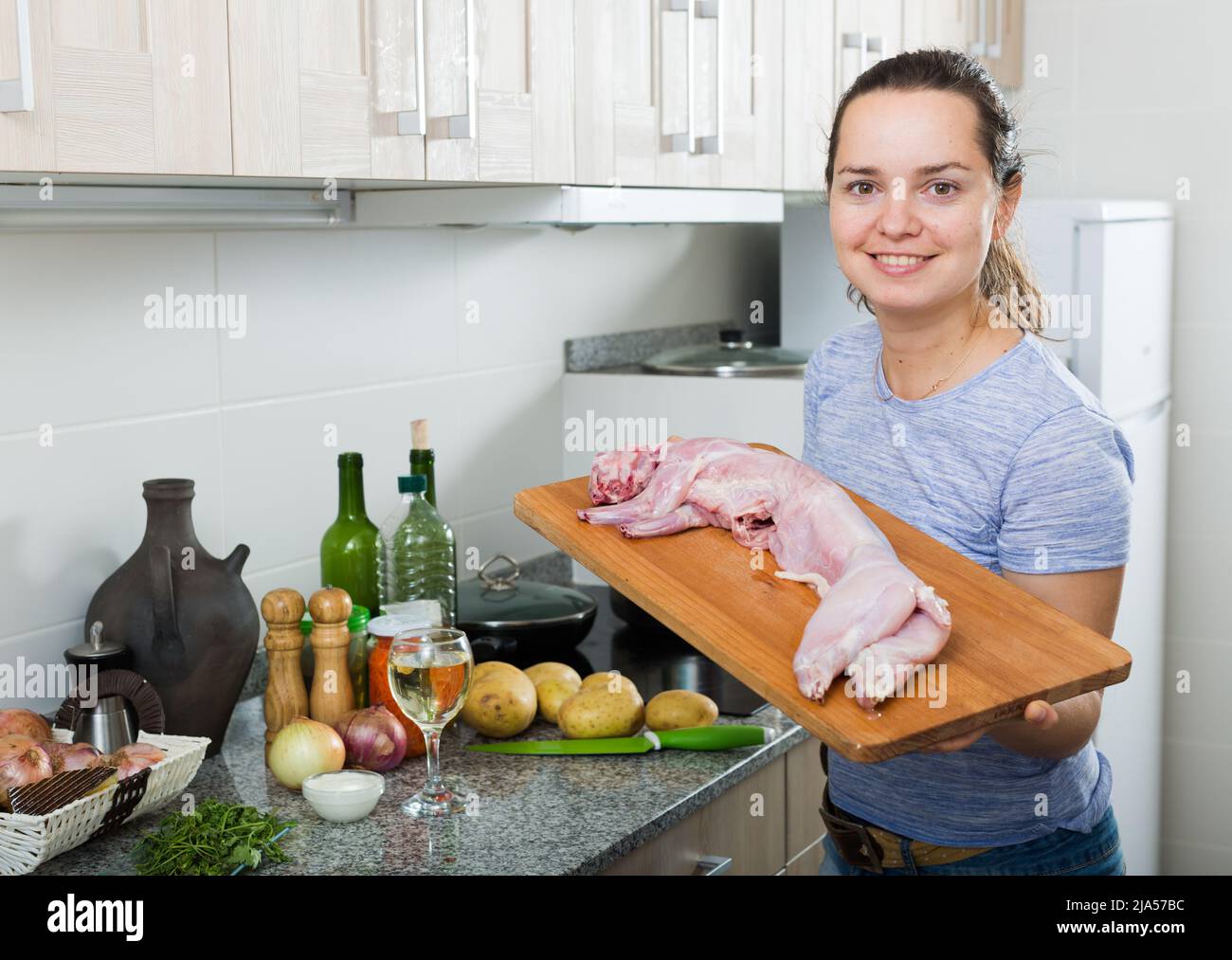 Woman cooking rabbit hi-res stock photography and images - Alamy
