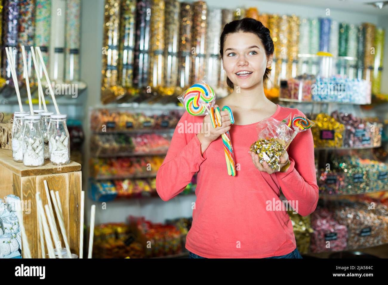girl buying candies at shop Stock Photo - Alamy