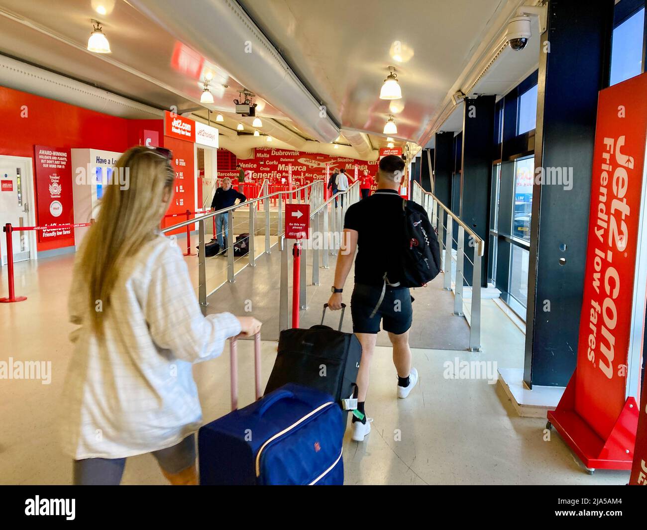 Passengers arrive at leeds bradford airport hi-res stock photography ...