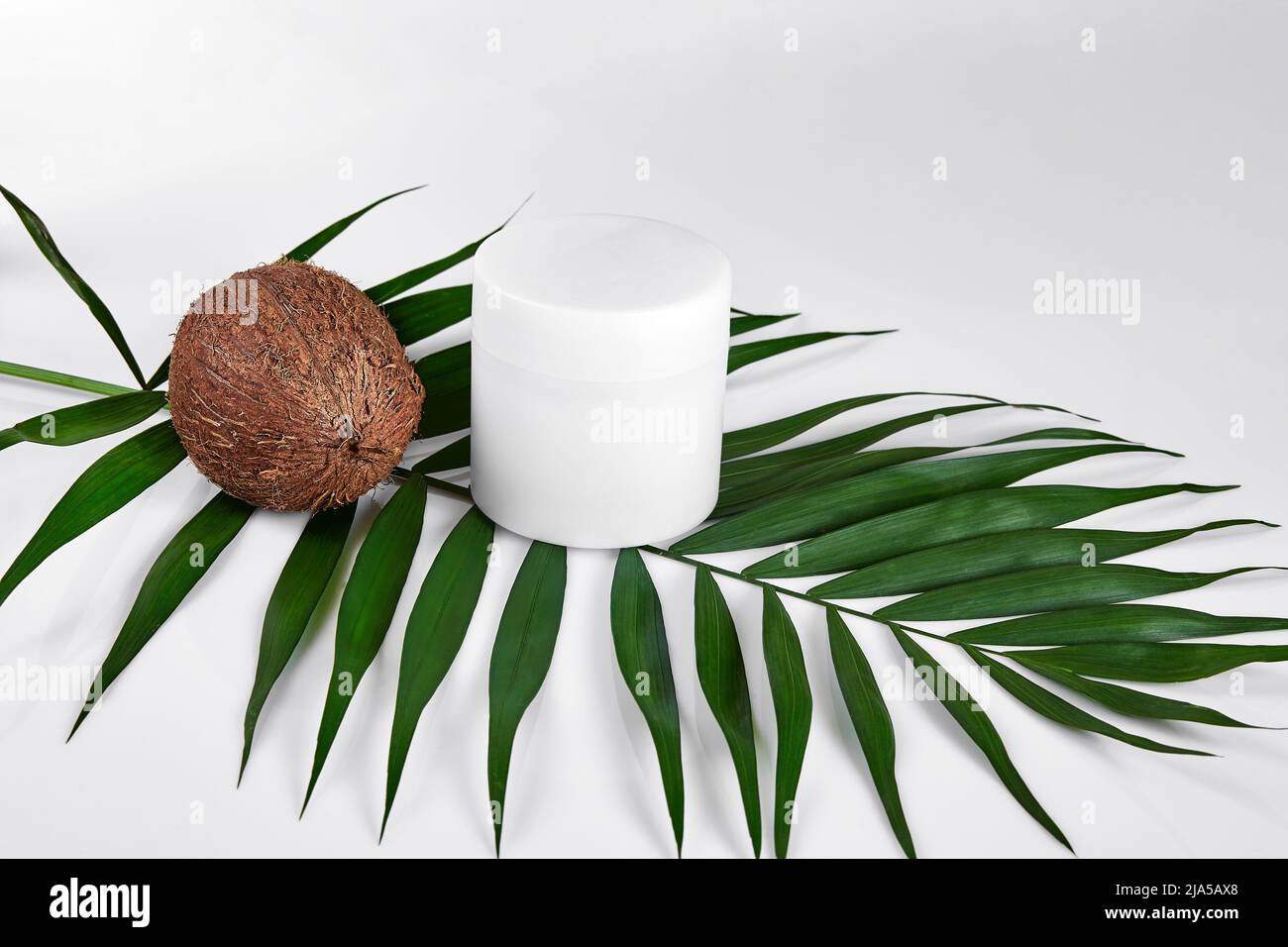 Skin care beauty treatment with jar of body moisturizer. White body ...