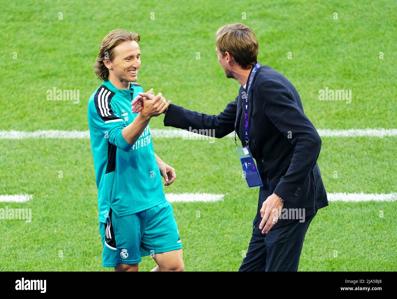 Real Madrid's Luka Modric greets Peter Couch on the touchline during a ...