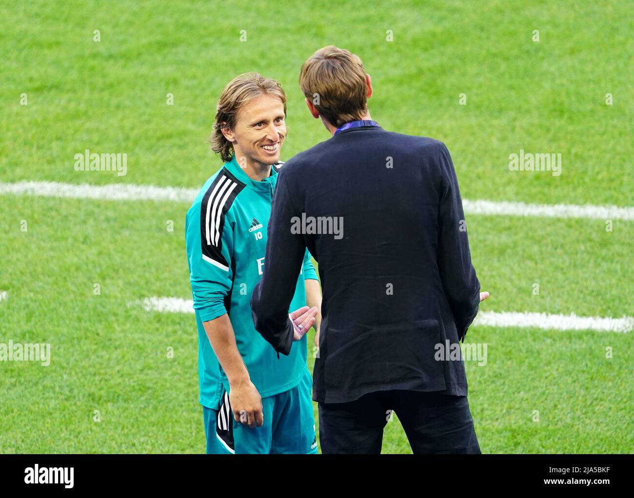 Real Madrid's Luka Modric greets Peter Couch on the touchline during a ...