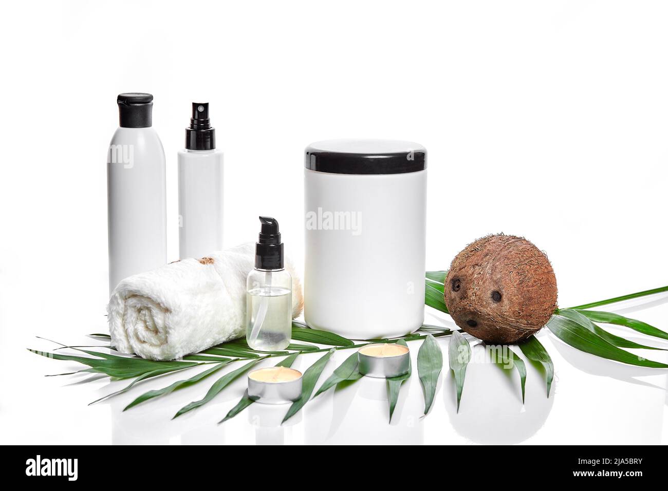 Organic cosmetics with coconut on white background Stock Photo - Alamy