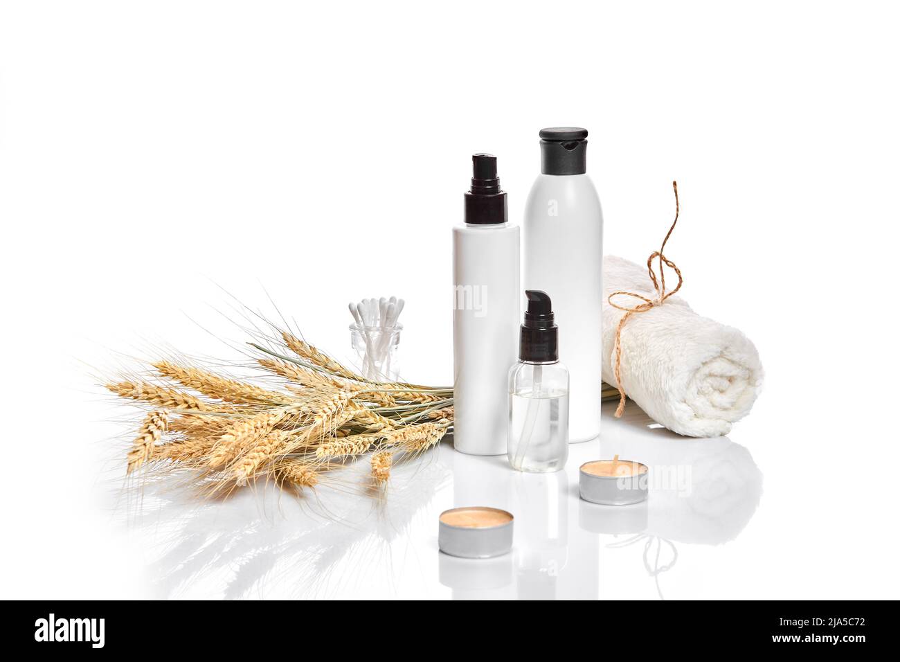 Herbal and mineral skincare. Jar of cream, oil with wheat, white ...