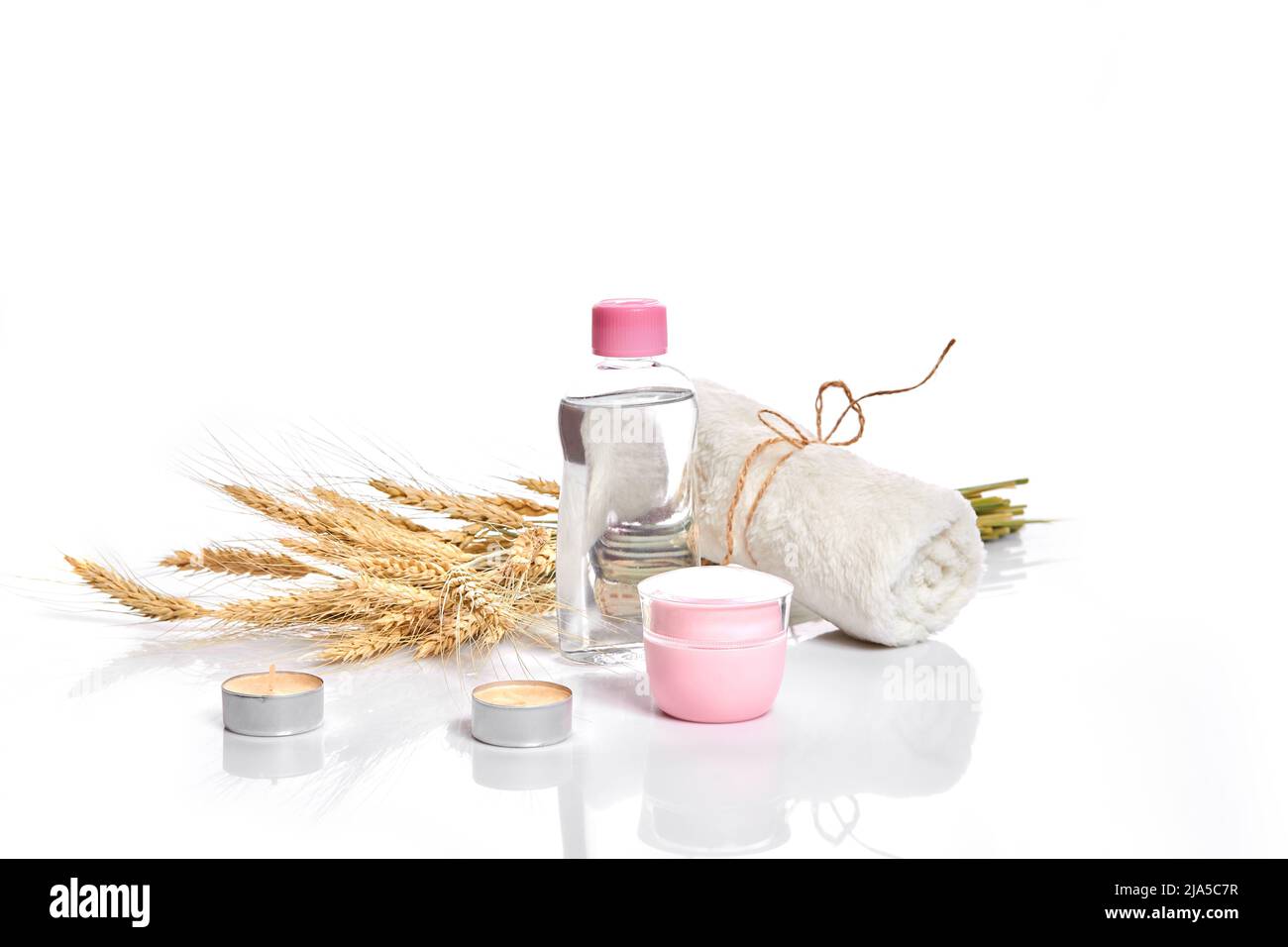 Herbal and mineral skincare. Jar of cream, oil with wheat, cosmetic ...