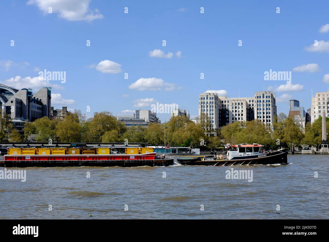 Thames tug boat tows container barge on River Thames, London, UK Stock ...