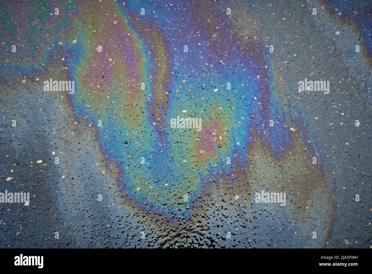Gasoline oil spill on the pavement as a texture or background Stock ...