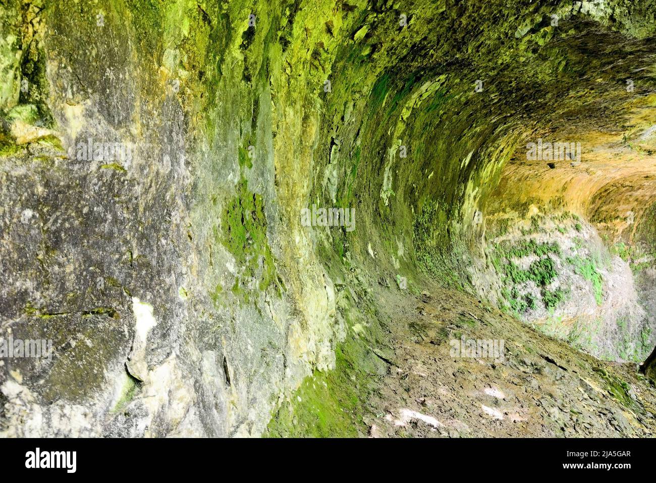 Natural passage in the rock to the Varyalsky waterfall, Abkhazia Stock ...