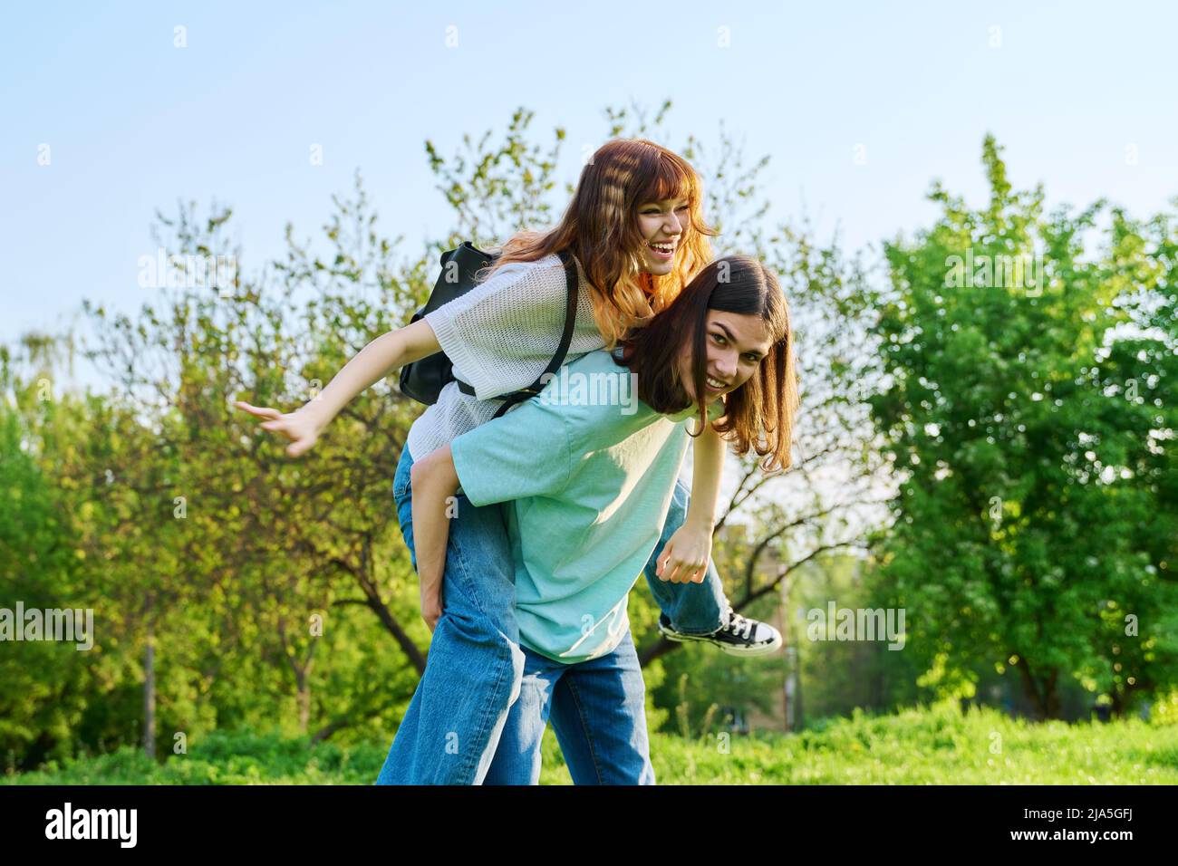 Couple of happy having fun teenagers together outdoor Stock Photo - Alamy