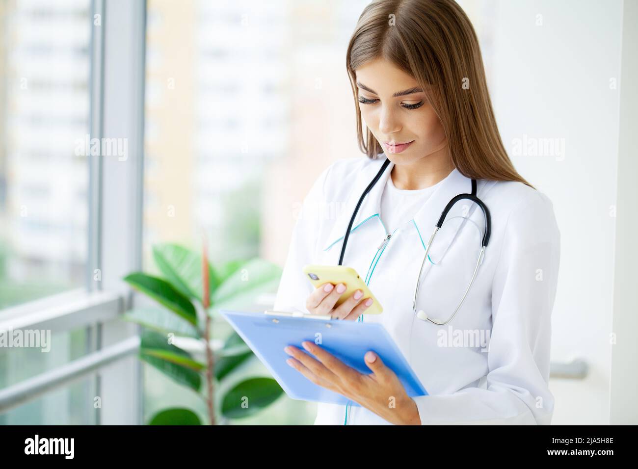 Medical beautiful female doctor in white coat with stethoscope Stock ...