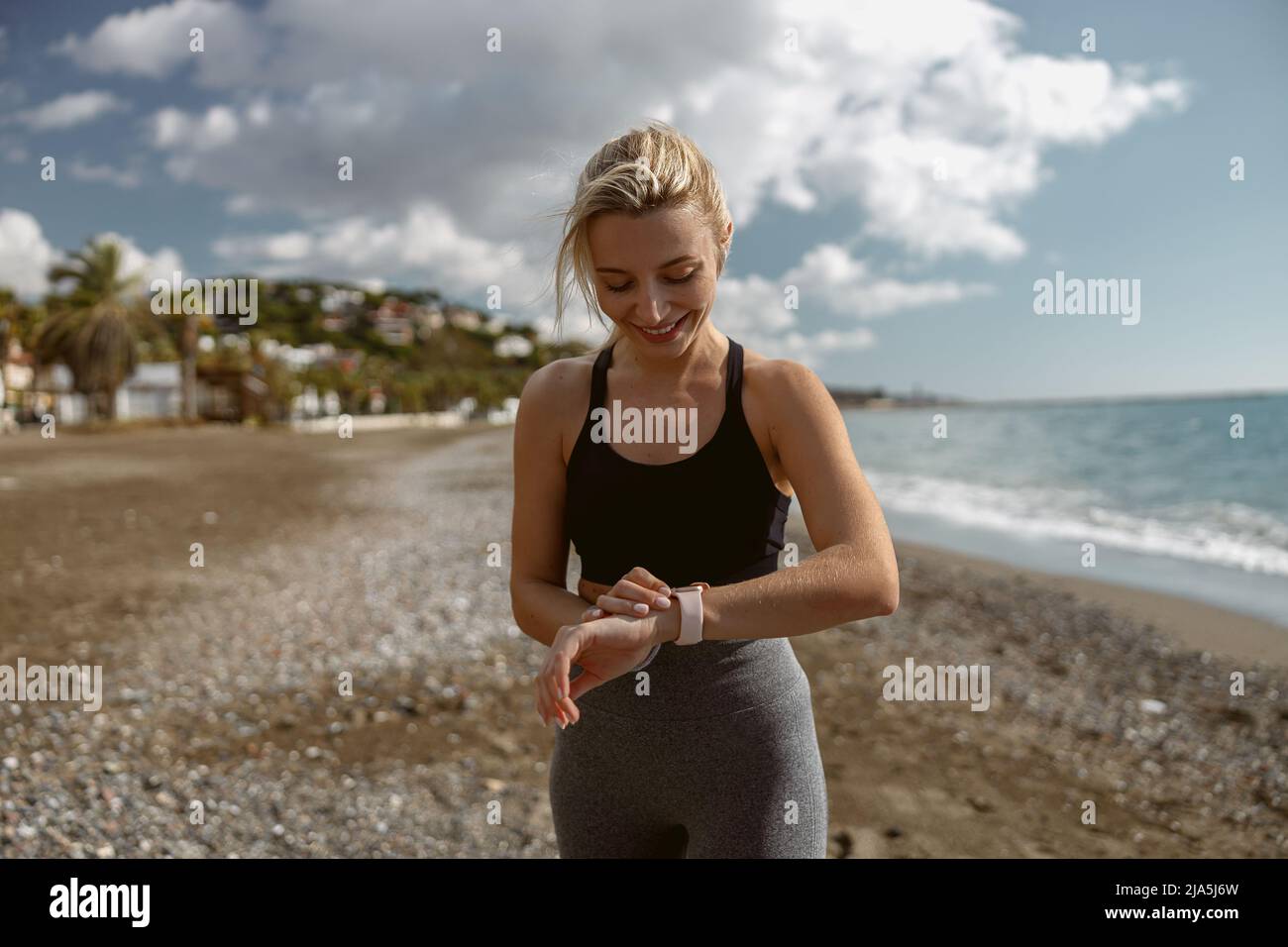Woman jogging near beach hi-res stock photography and images - Alamy