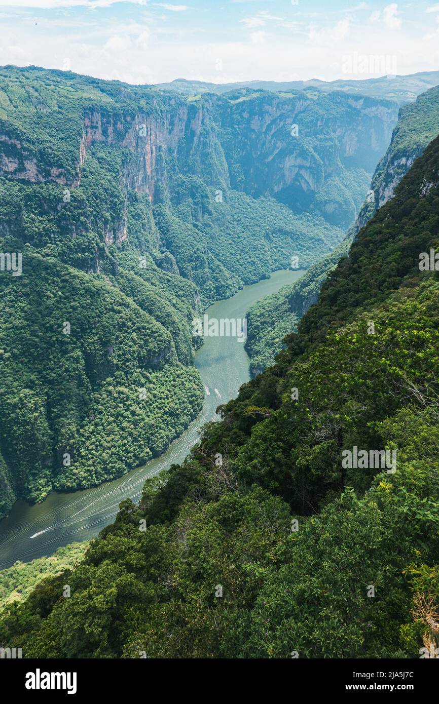 boats carry tourists up and down the Grijalva River through Sumidero ...