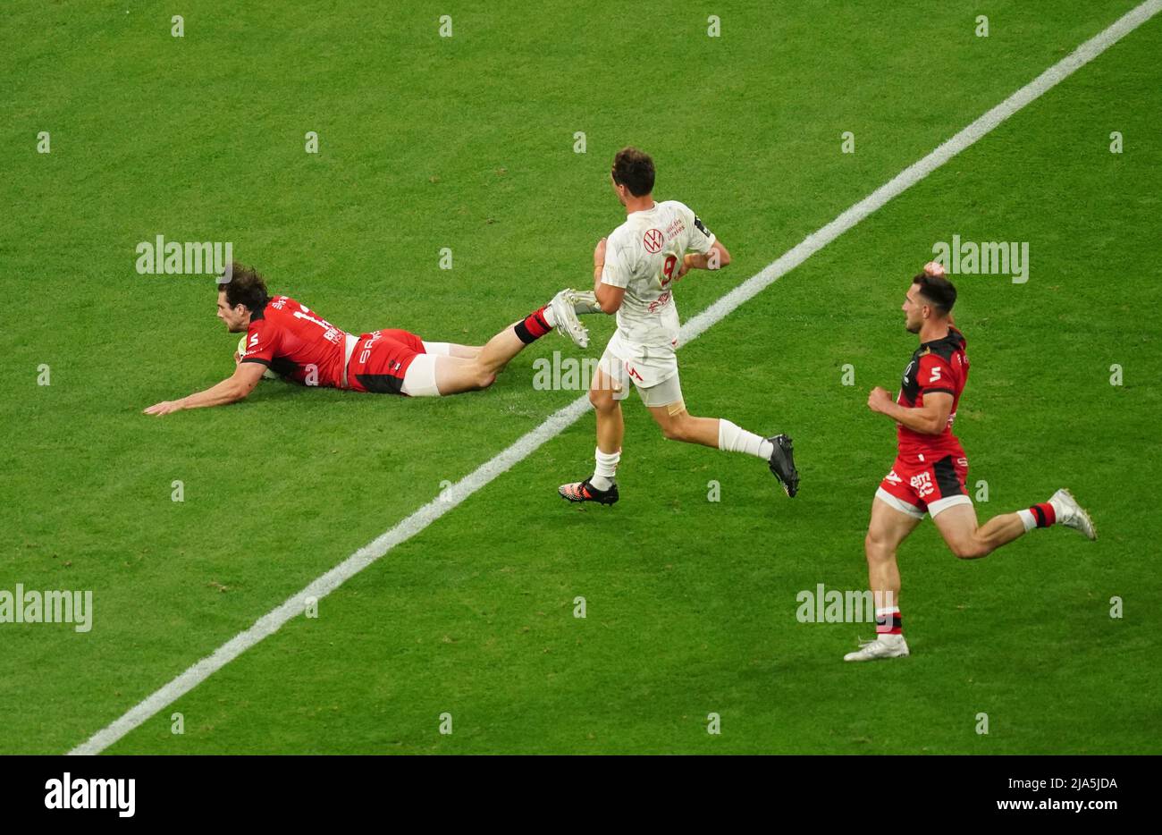 Lyon's Pierre Louis Barassi (right) scores their side's second try of ...