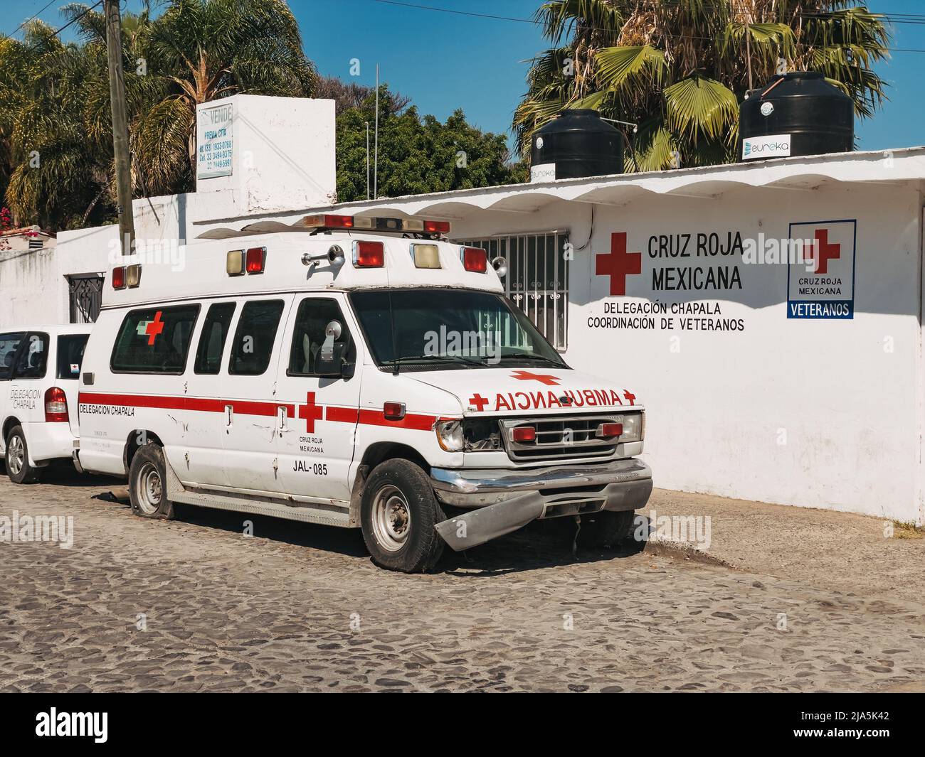 a beat up and broken down ambulance outside a Red Cross Mexico office ...