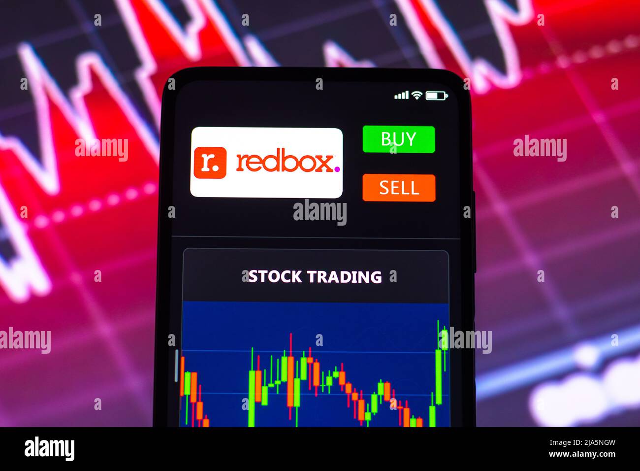 In this photo illustration the stock trading graph of Redbox ...
