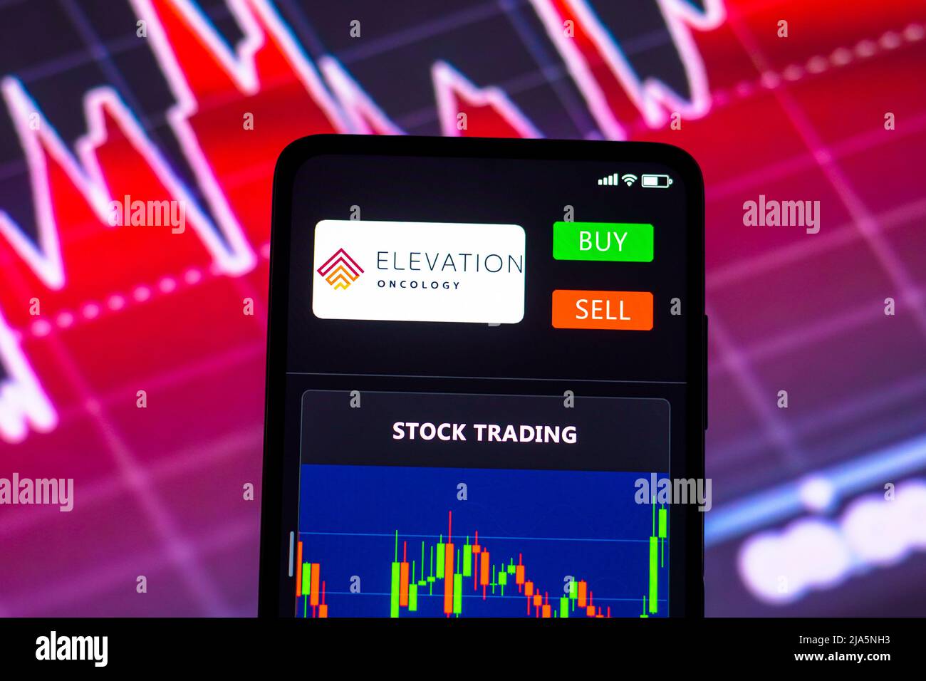 In this photo illustration the stock trading graph of Elevation ...