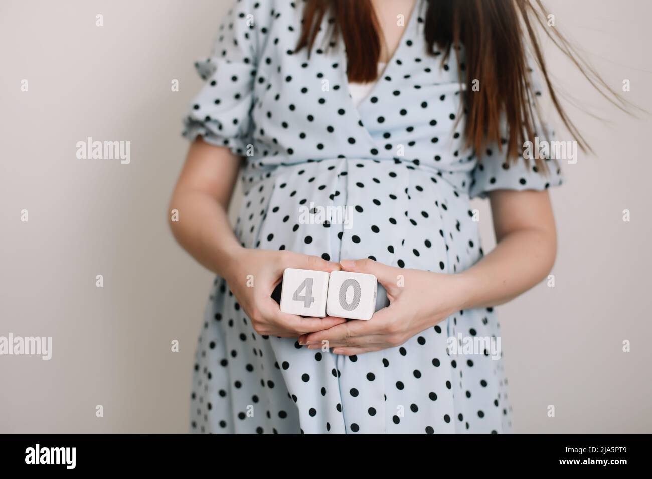 40 weeks of pregnancy. Pregnant woman touching belly. Happy woman ...