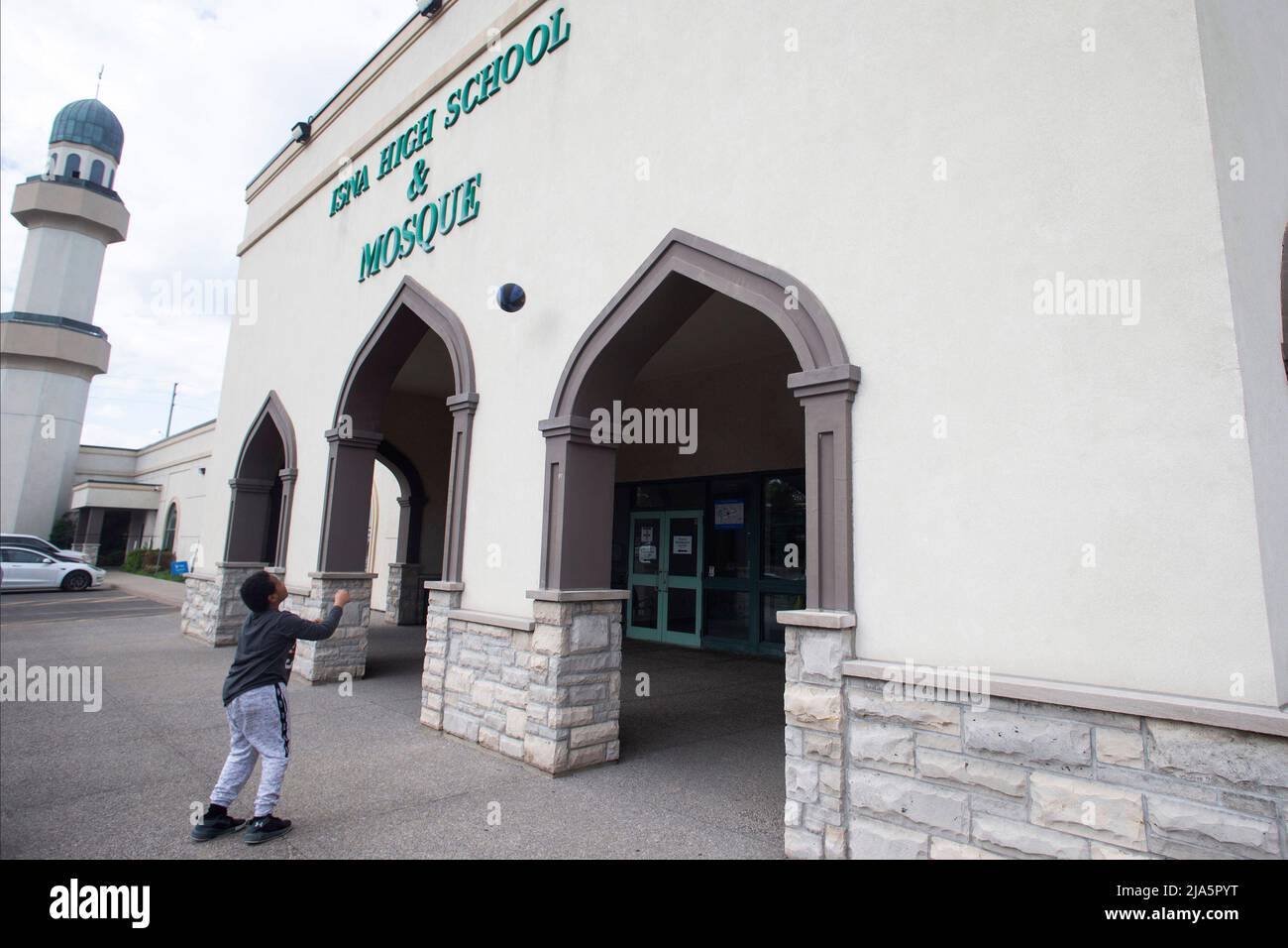 A boy plays with a ball outside ISNA Mosque in Mississauga, Ont., on ...